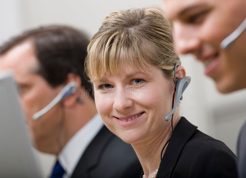 Co-workers Working at Computers in Call Center Stock Image - Image of ...