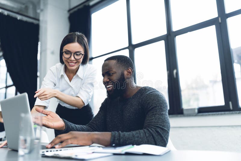 Young and Heterogeneous Co-workers Working with Pc in the Office Stock ...