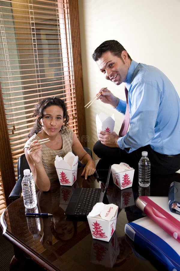 Co-workers in Office Eating Chinese Takeout Food Stock Photo - Image of ...