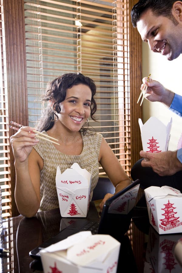 Co-workers in Office Eating Chinese Take-out Food Stock Image - Image ...