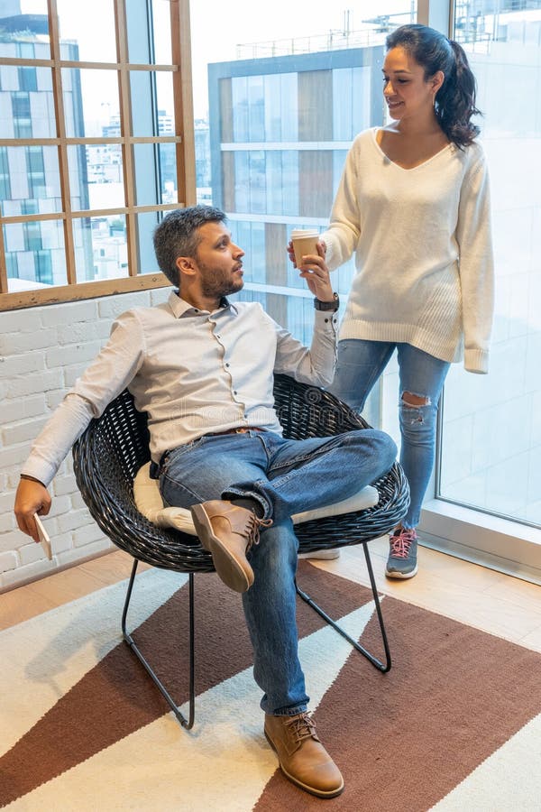 Co-workers Sharing a Container of Coffee Stock Image - Image of ...