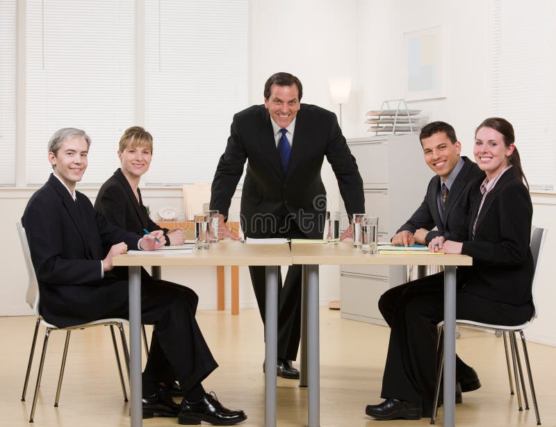 Co-workers Sitting at Conference Table Stock Image - Image of authority ...