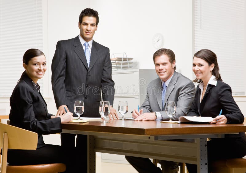 Co-workers and Supervisor in Conference Room Stock Photo - Image of ...