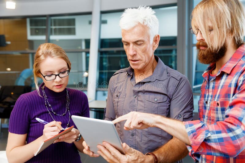 Co-workers Working Together Stock Photo - Image of businessman, indoors ...