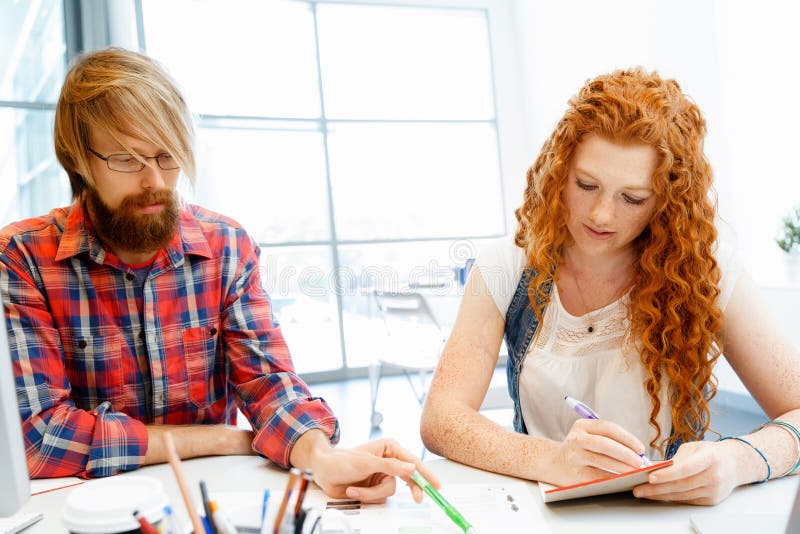Co-workers Working Together Stock Photo - Image of indoors, budget ...