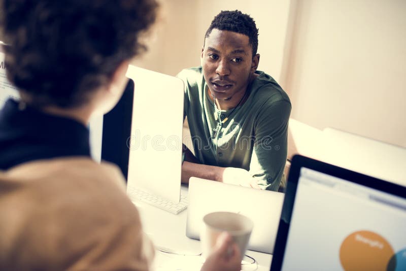 Co-workers Working Together and Using Computer Stock Image - Image of ...