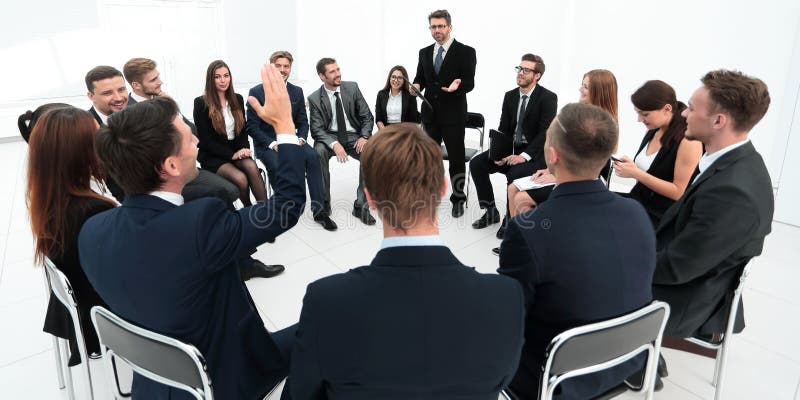 Coach Asks Questions To the Participants of the Training. Stock Photo ...
