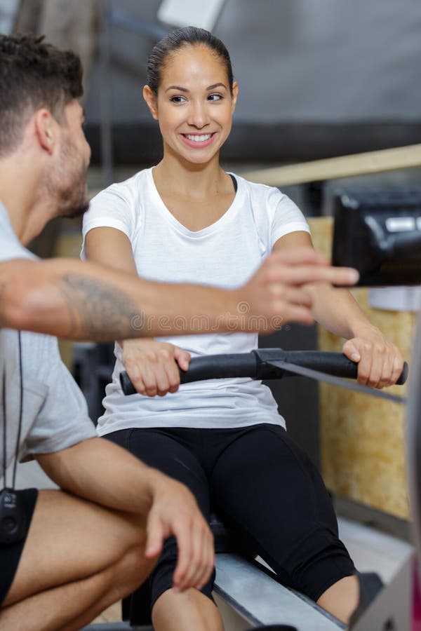 Coach Assisting Beginner Female Client Stock Photo - Image of body ...