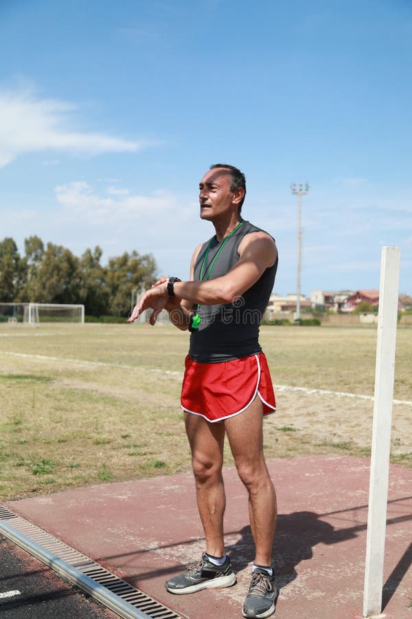 Coach Checking Time on His Smartwatch Stock Photo - Image of sportswear ...