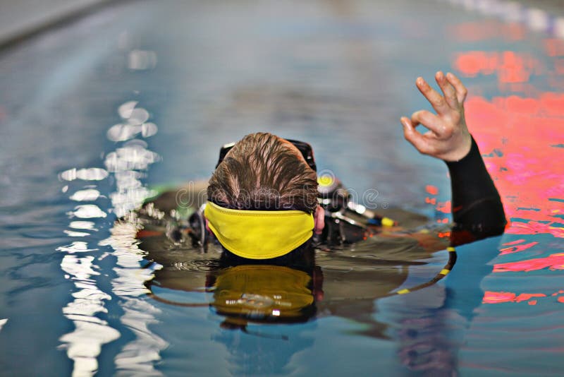 Coach diving in water stock image. Image of instructor - 63963731