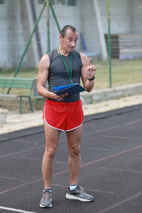 Coach Following the Paper Workout Plans Stock Photo - Image of coach ...