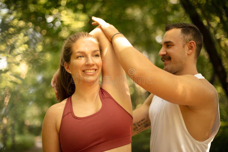Coach Helping Woman in Exercise Stock Photo - Image of girlfriend, care ...
