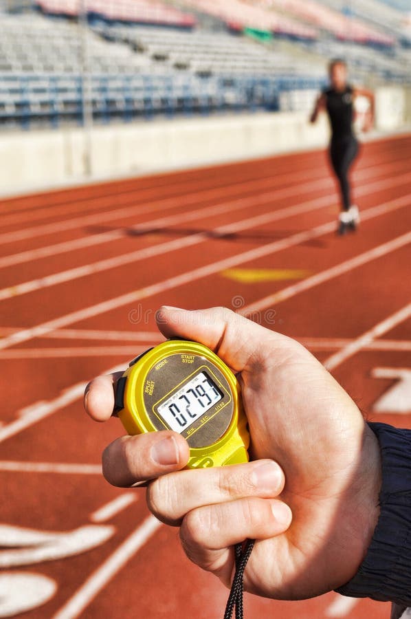 Coach Holding Stopwatch Timing Runner Stock Photo - Image of adult ...