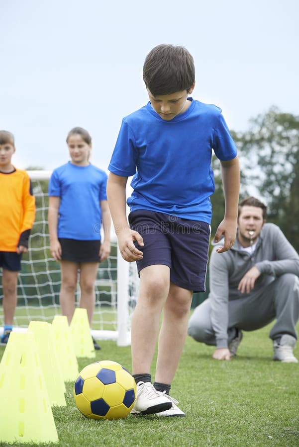 Coach Giving Team Talk To Elementary School Soccer Team Stock Photo ...