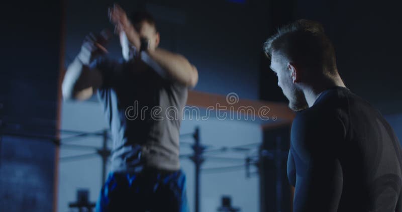 Instructor Watching Sportive Man Training in Gym Stock Video - Video of ...