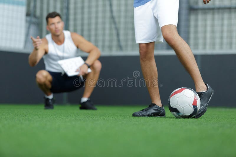 Coach and Man Playing Football Indoor Stock Photo - Image of procedure ...
