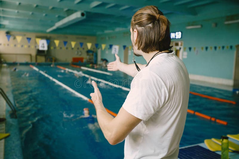 Coach Practise With Swimmer In The Indoor Swimming Pool Stock Image