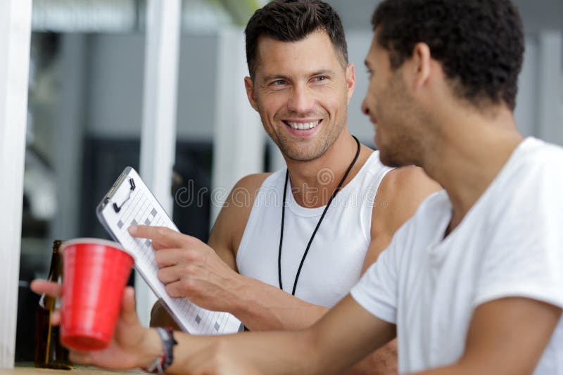 Coach Showing Clipboard To Professional Boxer Stock Photo - Image of ...