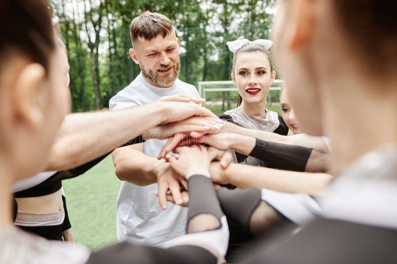 Coach Supporting Cheerleading Team Outdoors Stock Photo - Image of ...
