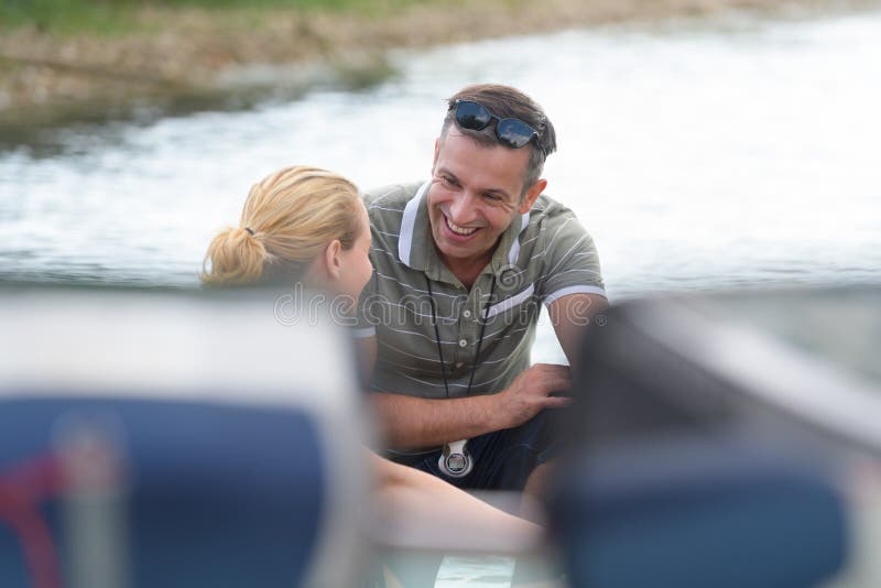 Coach Talking To Lady Performing Watersports Stock Photo - Image of ...