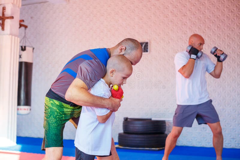 The Coach Teaches The Boy Kick Boxing Stock Photo - Image of activity ...