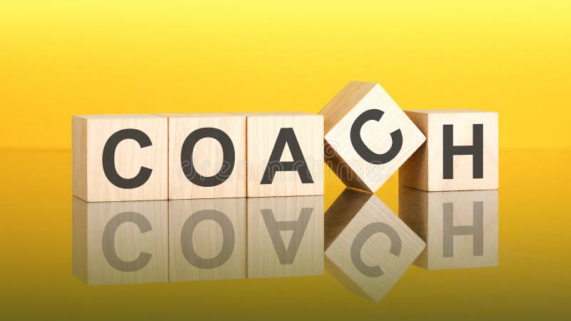 COACH - Text of on Wooden Cubes, Reflected from the Bright Yellow ...