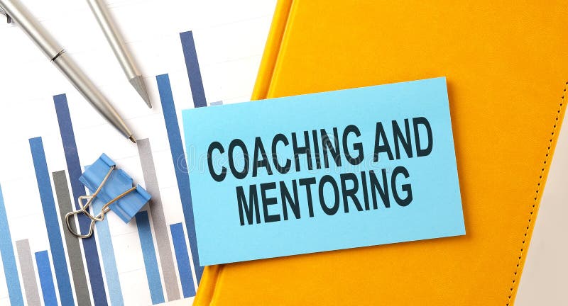 COACHING and MENTORING Message on Blue Sticker on Notebook with Chart ...