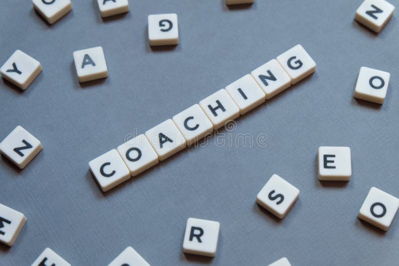 Coaching Word Made of Square Letter Word on Grey Background. Stock ...