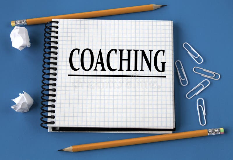 COACHING - Word in a White Notebook on a Blue Background with Pencils ...