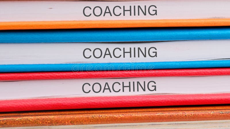 COACHING Written on the Ends of Notebooks Lying on Top of Each Other ...