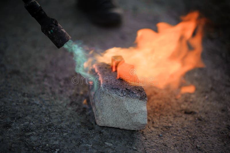 Coal on Fire. Ignition of Square Coal with a Gas Burner on a Stone ...