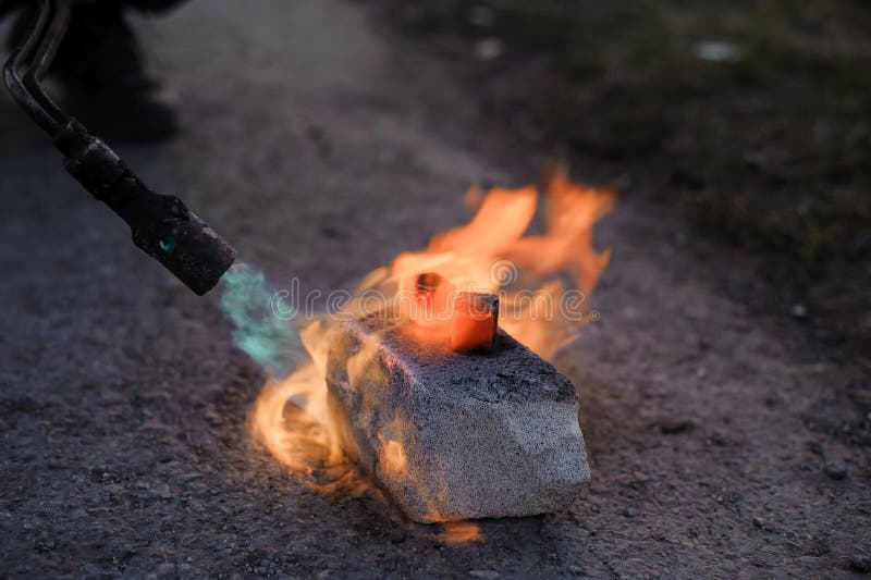 Coal on Fire. Ignition of Square Coal with a Gas Burner on a Stone ...