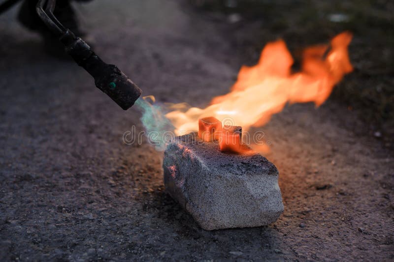 Coal on Fire. Ignition of Square Coal with a Gas Burner on a Stone ...