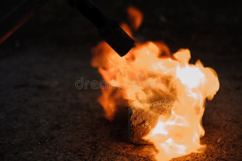 Coal on Fire. Ignition of Square Coal with a Gas Burner on a Stone ...