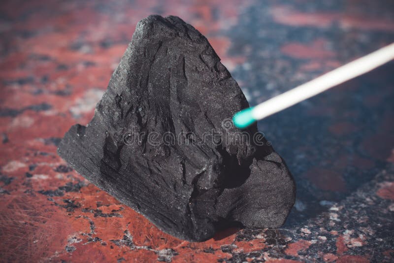 Coal on a Granite Stone and a Match, Close-up Stock Image - Image of ...