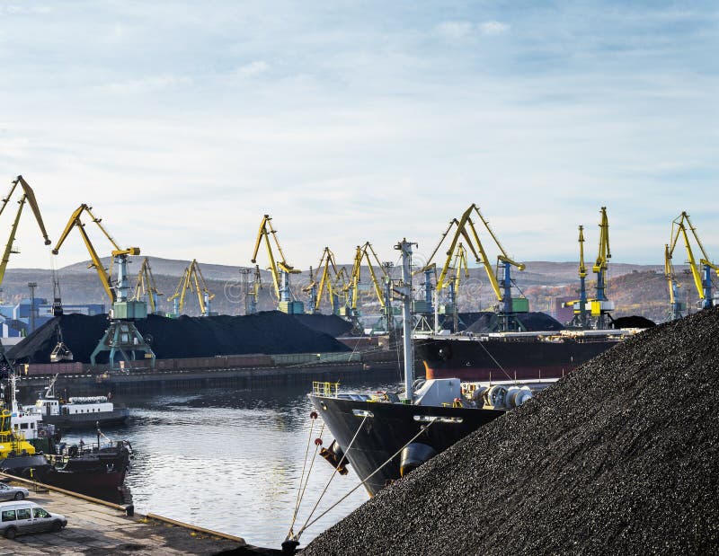 Coal is Loaded into the Holds of a Dry Cargo Ship in the Seaport 24 ...