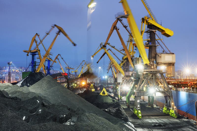 Coal is Loaded into the Holds of a Dry Cargo Ship in the Seaport 24 ...