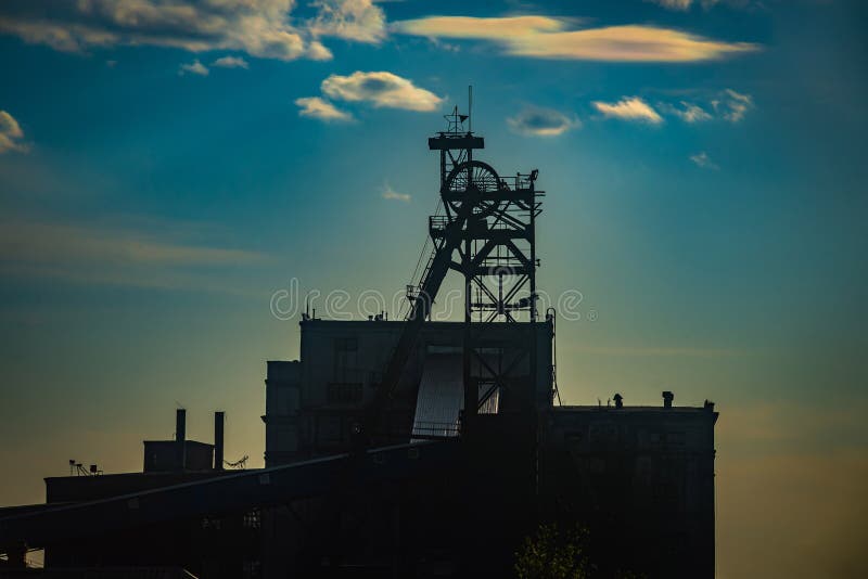 Coal Mine on the Background of Light Clouds in the Sunset Stock Photo ...