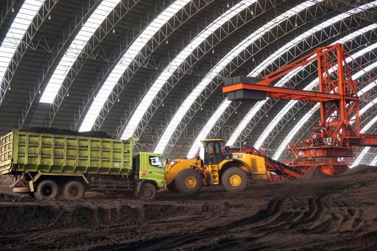 Coal Mining Operation Featuring Heavy Machinery and a Large Indoor ...