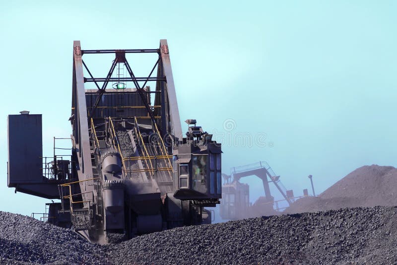 Coal moving machinery stock photo. Image of spinning - 10957668