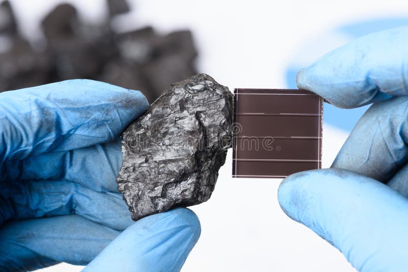 Coal Next To Solar Panel in Scientist Hands in Laboratory Stock Photo ...