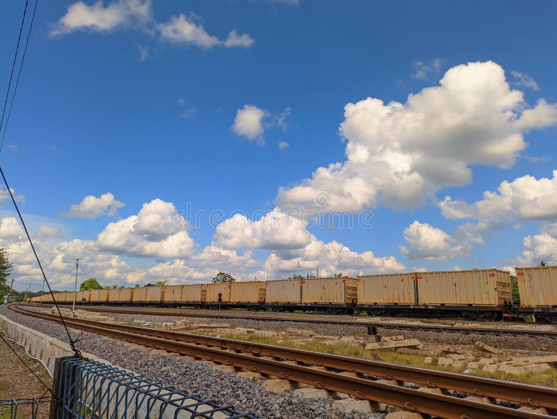A Coal Train Under a Pile of Clouds Editorial Stock Photo - Image of ...