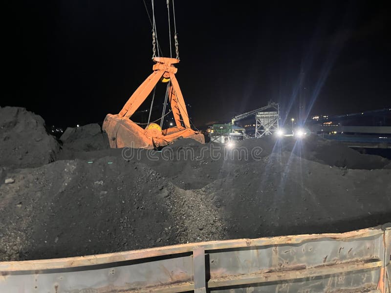 Coal Unloading Process on Barges Using Floating Cranes Stock Photo ...