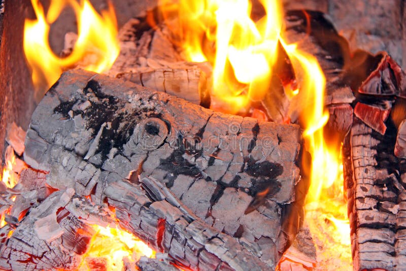 Coals smolder in a fire stock image. Image of burn, flame - 175330389