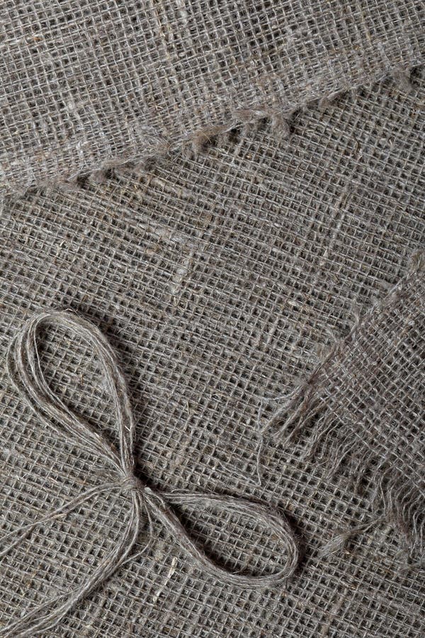 Coarse Linen Fabric. on it Lies a Bow of Linen Thread Stock Image ...