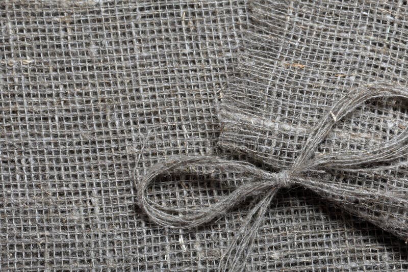 Coarse Linen Fabric. on it Lies a Bow of Linen Thread Stock Image ...