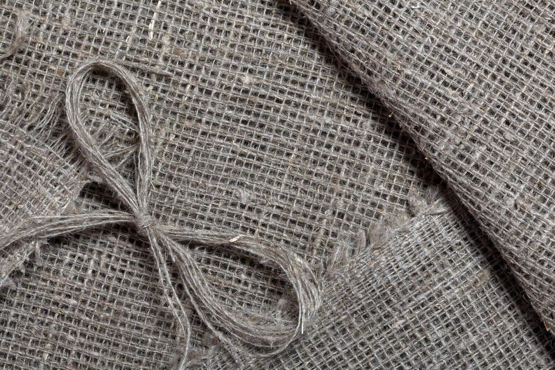 Coarse Linen Fabric. on it Lies a Bow of Linen Thread Stock Photo ...