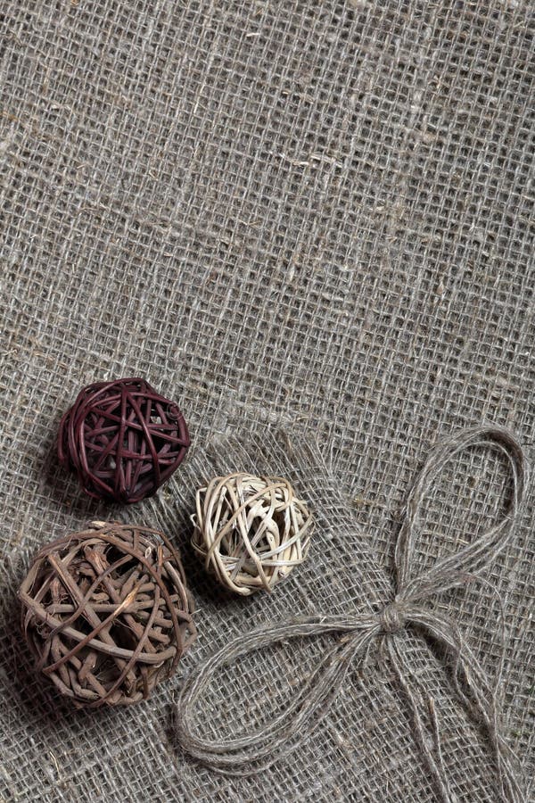 Coarse Linen Fabric. on it are Rattan Balls and a Bow of Linen Threads ...