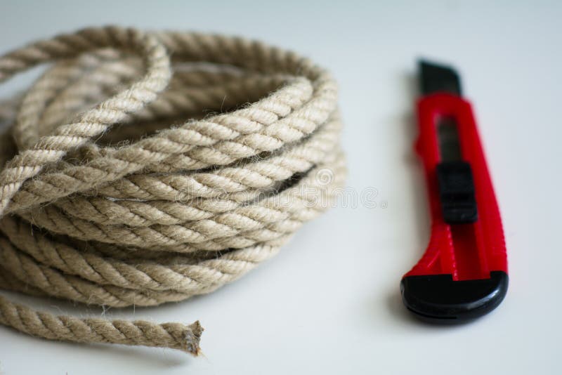 Coarse Rope Roll and a Knife with a Red Handle Stock Photo - Image of ...