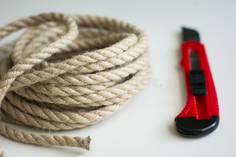 Coarse Rope Roll and a Knife with a Red Handle Stock Photo - Image of ...